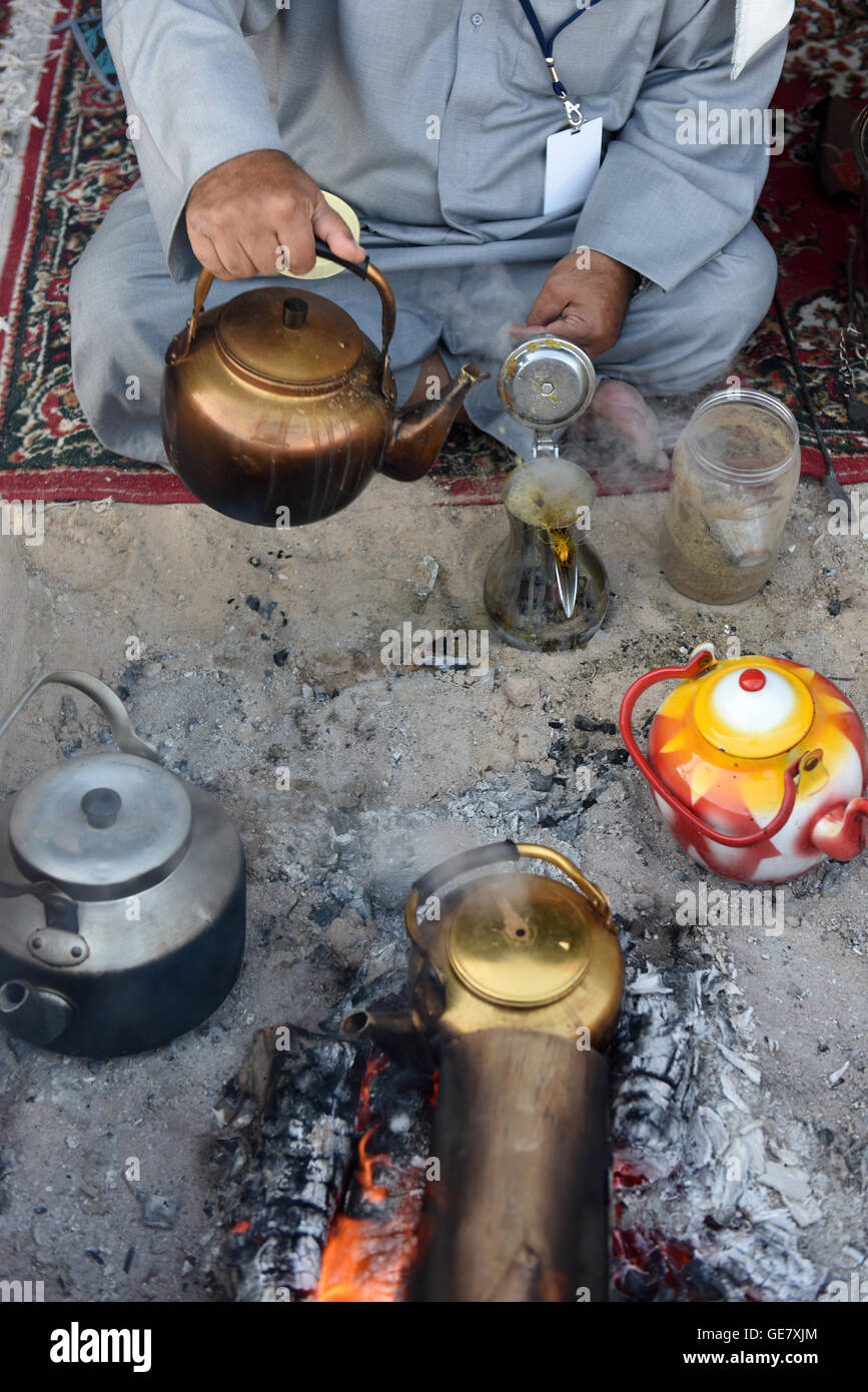 Preparation of the tea on fire in the traditional way Stock Photo - Alamy