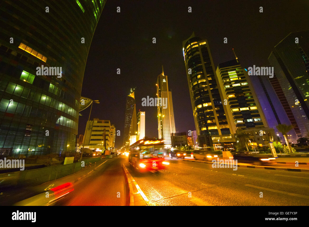 Public bus on the streets of downtown Kuwait City at night. Kuwait ...