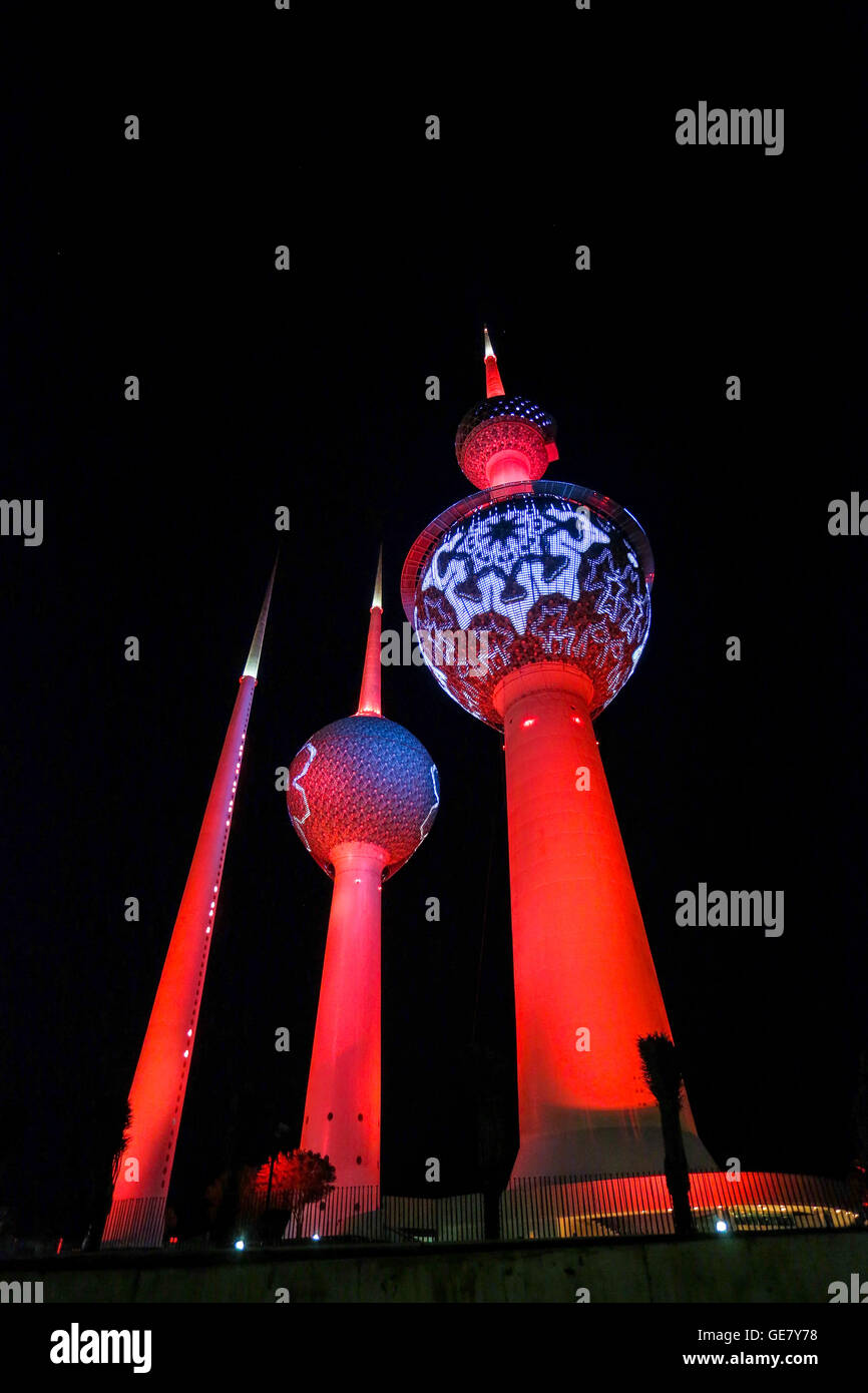 Kuwait Towers with animated graphics light at night Stock Photo - Alamy