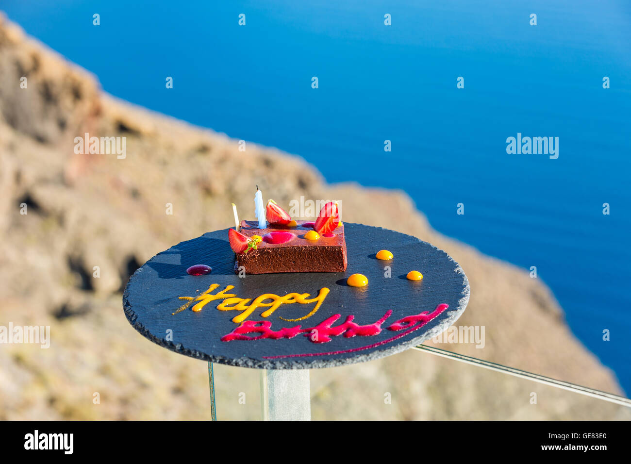 Birthday and cake on the seafront, Greece Stock Photo - Alamy
