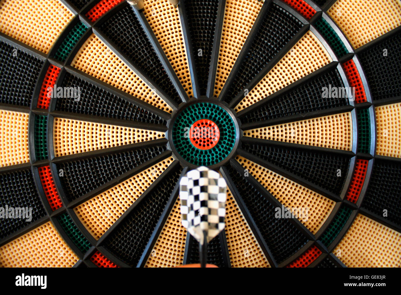 Dart arrow hitting in the target on dartboard Stock Photo - Alamy