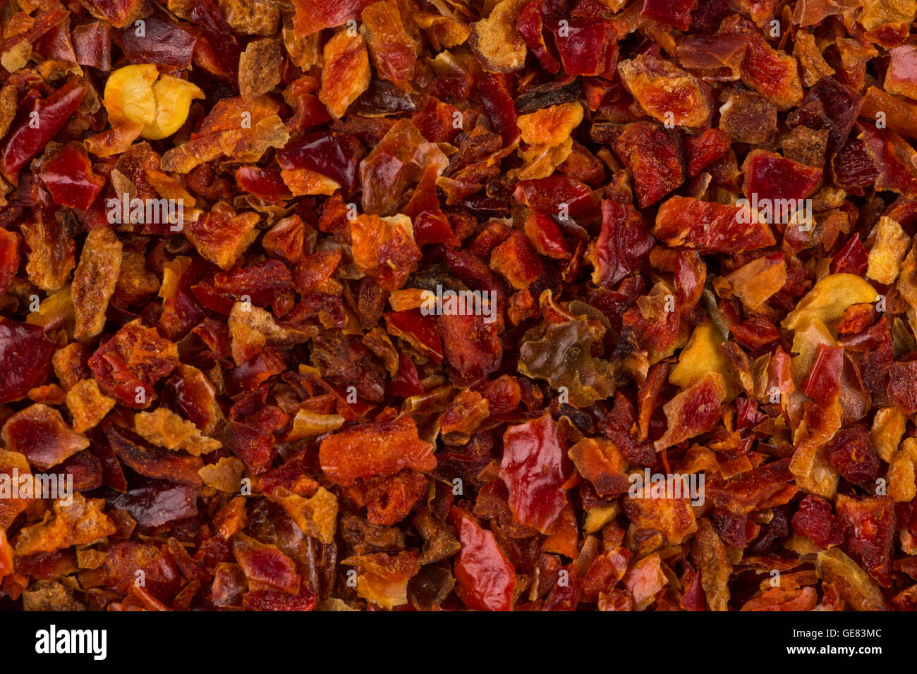 Crushed red chili pepper for background texture Stock Photo - Alamy
