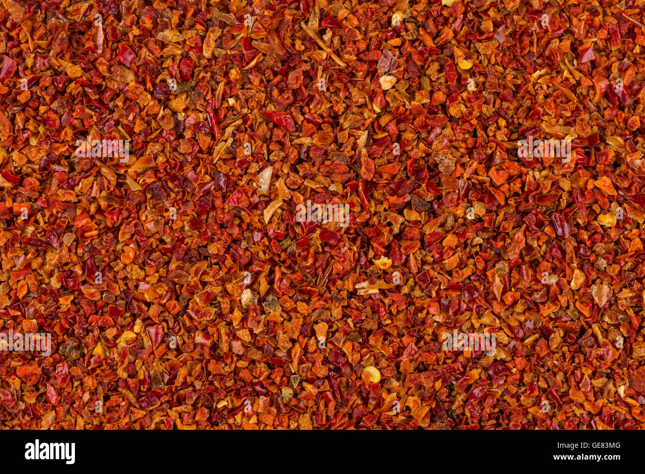 Crushed red chili pepper for background texture Stock Photo - Alamy