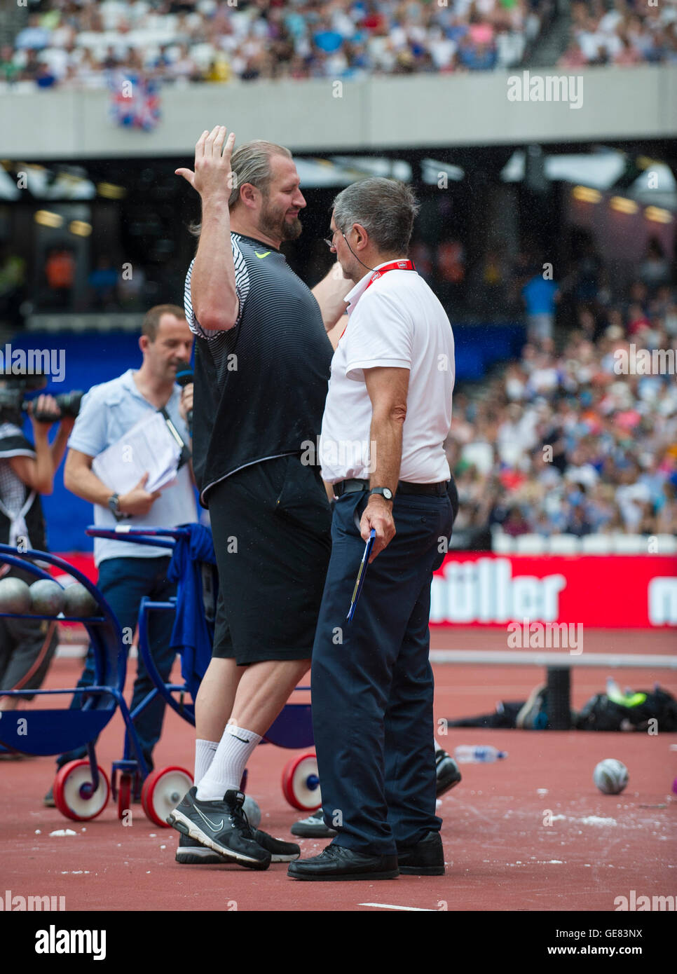 LONDON, ENGLAND - JULY 23: Tomasz Majewski complaing to the official in ...