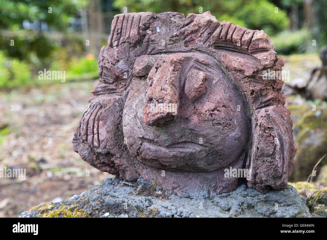 Volcanic stone face sculptures art in garden at Madalena do Pico ...