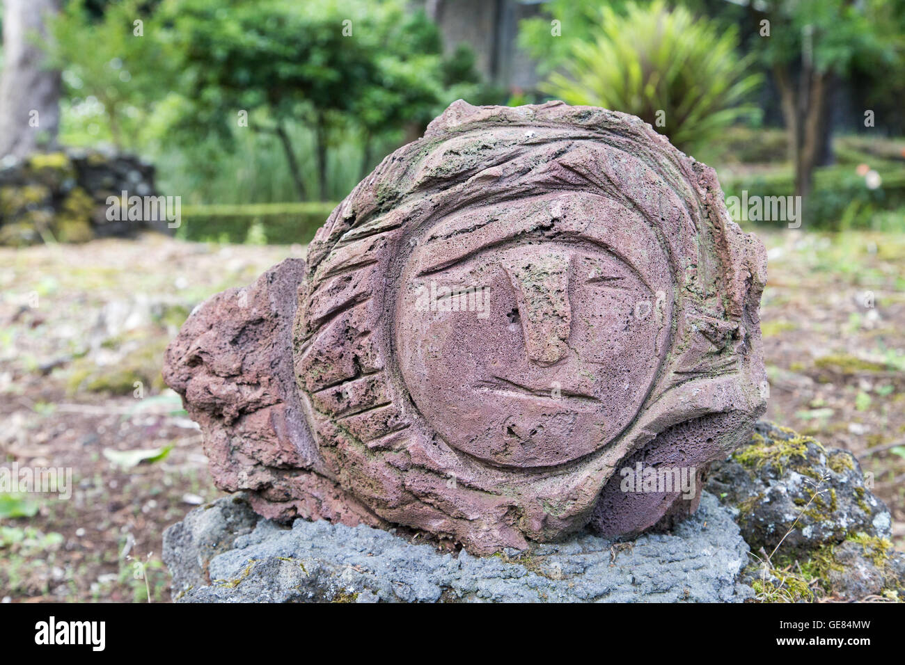 Volcanic stone face sculptures art in garden at Madalena do Pico ...