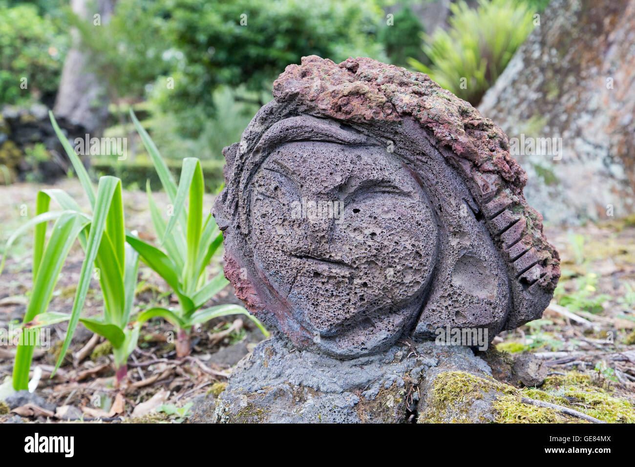 Volcanic stone face sculptures art in garden at Madalena do Pico ...