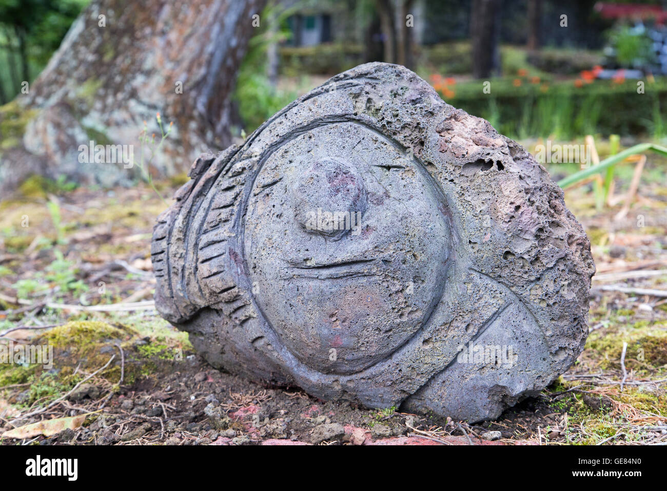 Volcanic stone face sculptures art in garden at Madalena do Pico ...