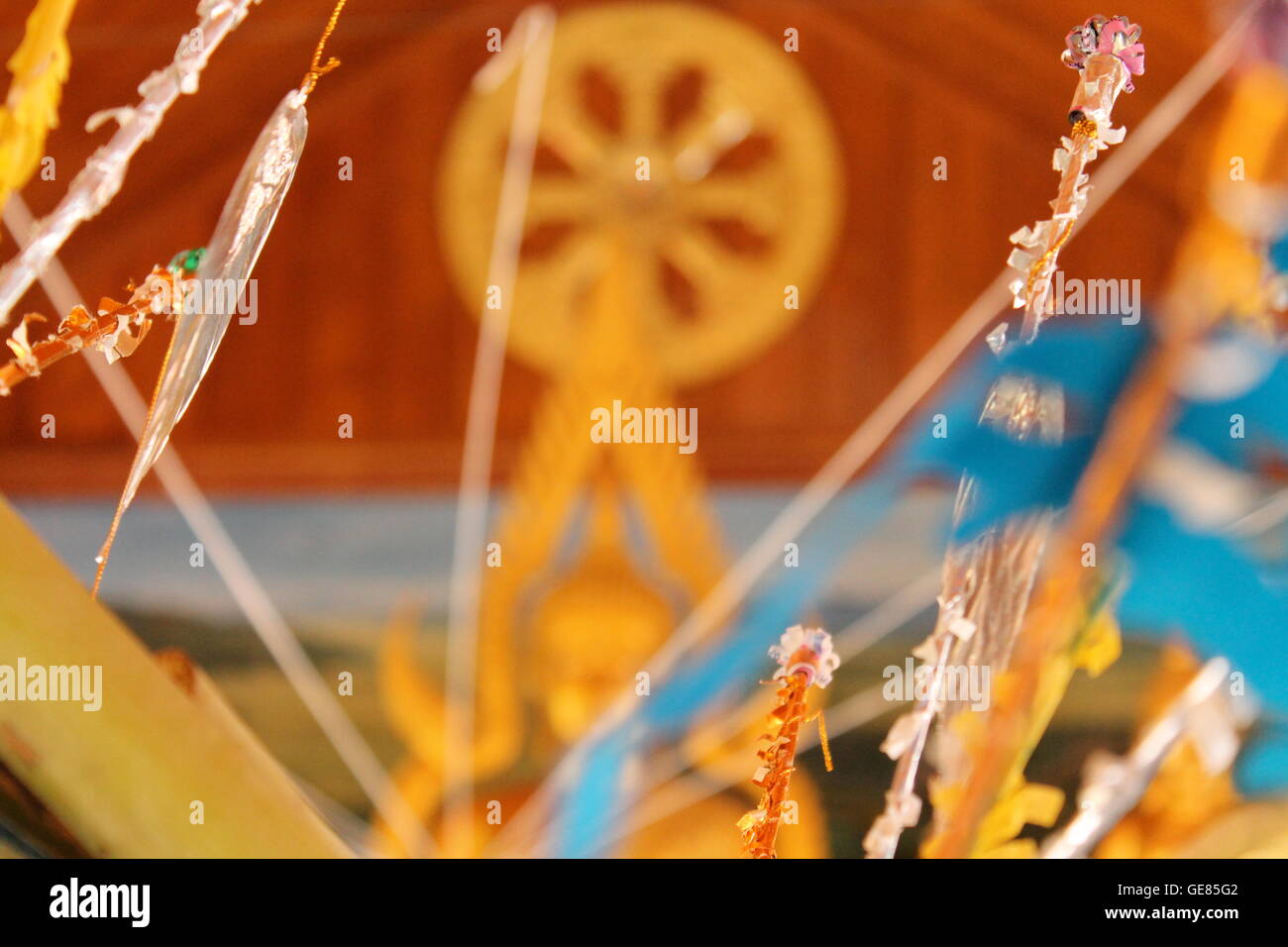 Buddha image in soft focus behind ritual accessories Stock Photo - Alamy