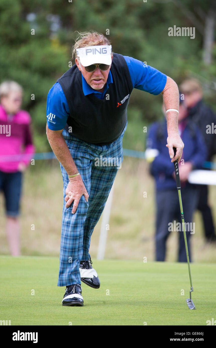 Spain's Miguel Angel Jimenez reads his putt on the 10th hole during day ...