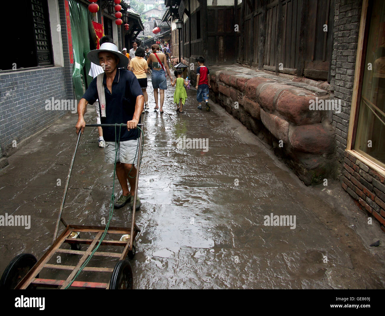 Rain-slicked flagstone street in Ciqikou Ancient Town, Chongqing, China ...