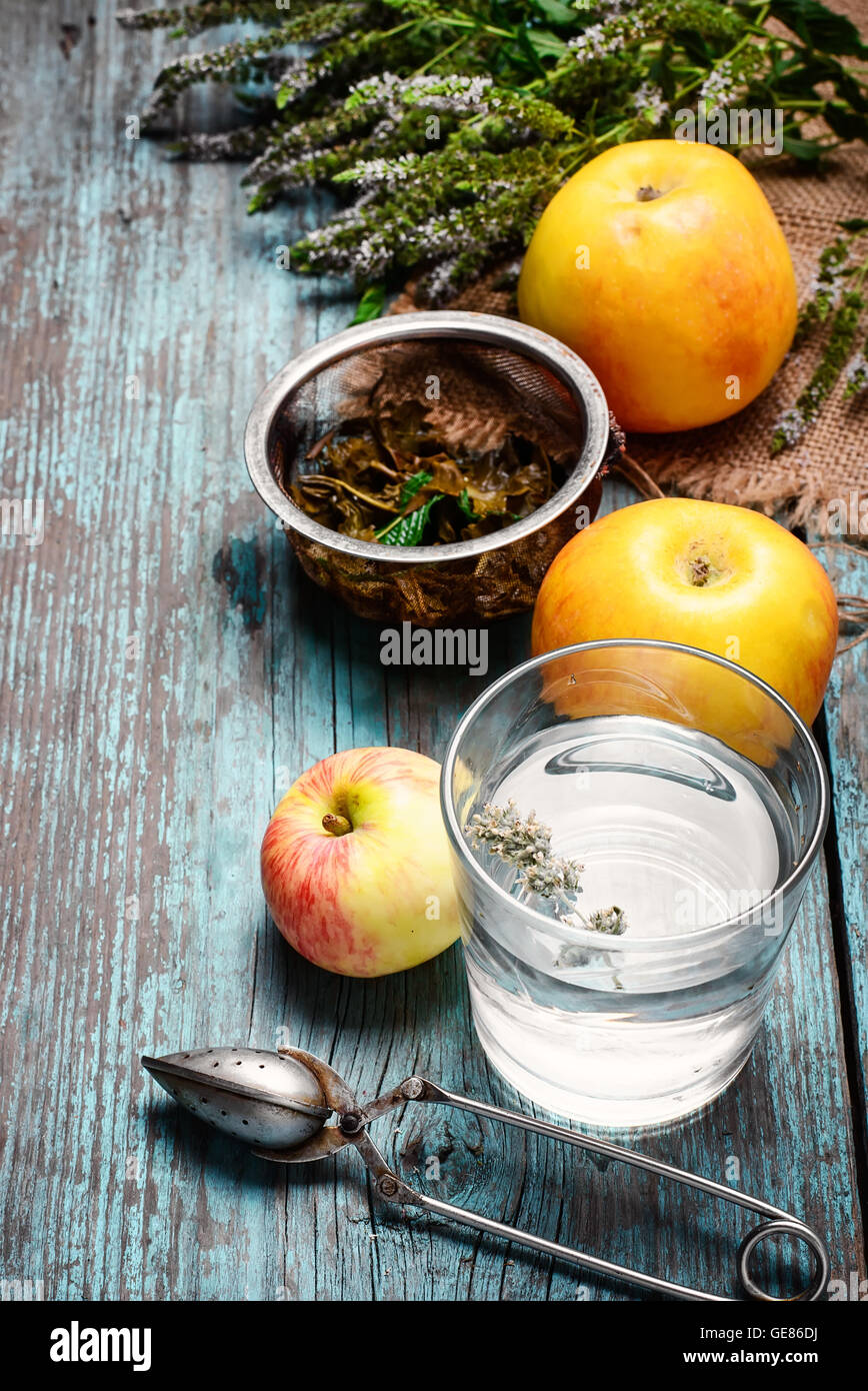 Plucked fresh bunch of fragrant mint,tea brew and apples Stock Photo ...