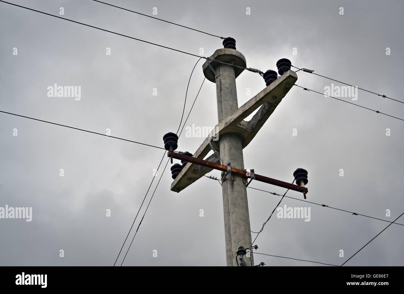 Closeup of a concrete electric pole with three phases Stock Photo - Alamy