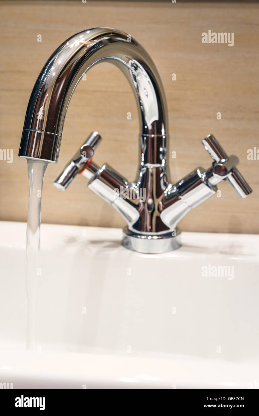 water tap with modern design in bathroom Stock Photo - Alamy