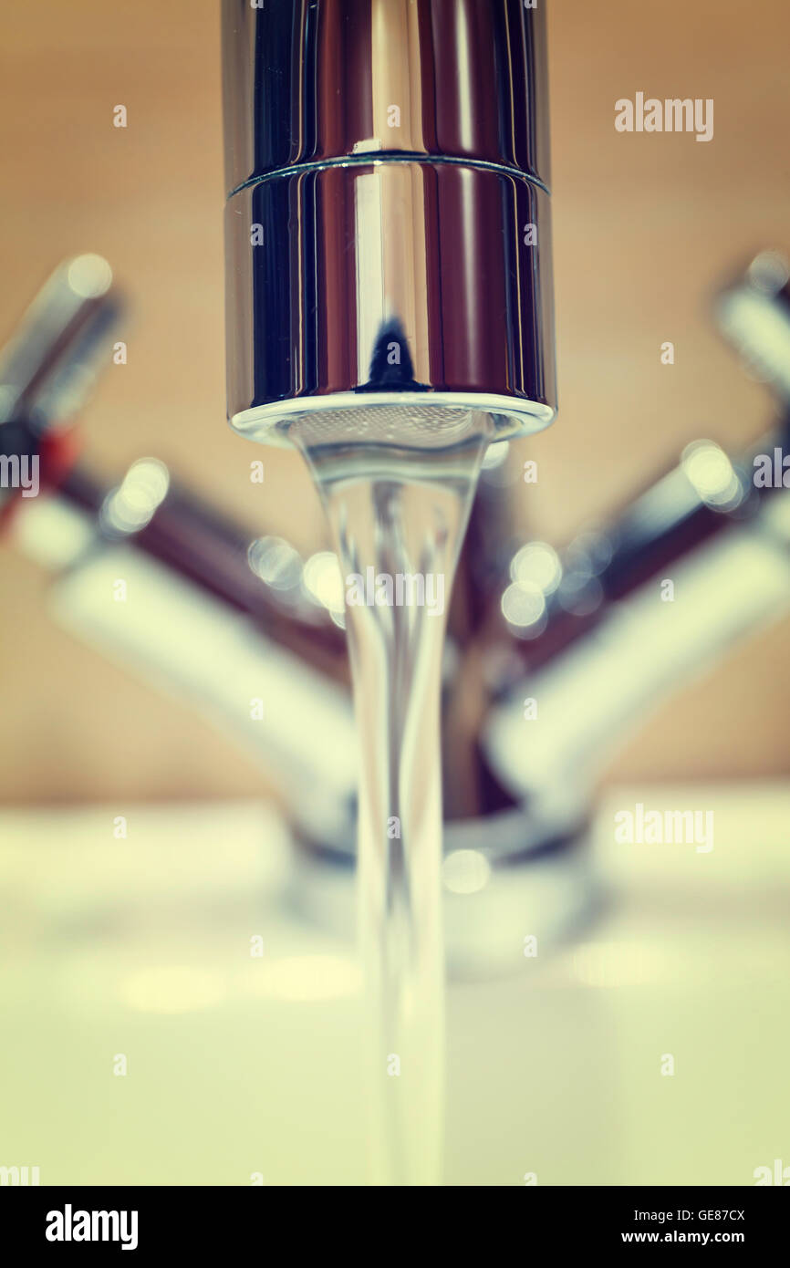 water tap with modern design in bathroom, vintage look Stock Photo - Alamy