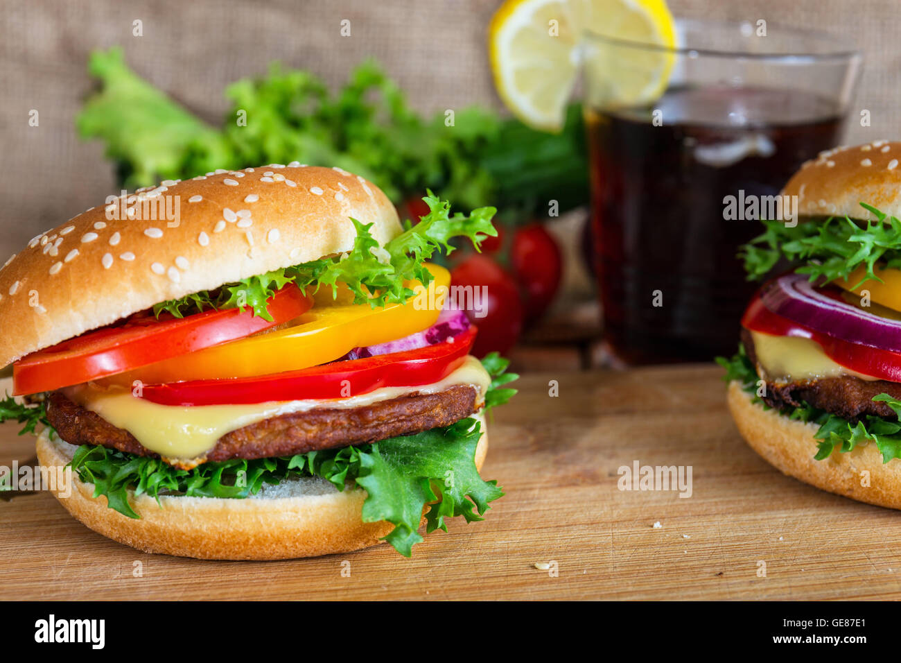hamburger and drink with slice of lemon Stock Photo - Alamy