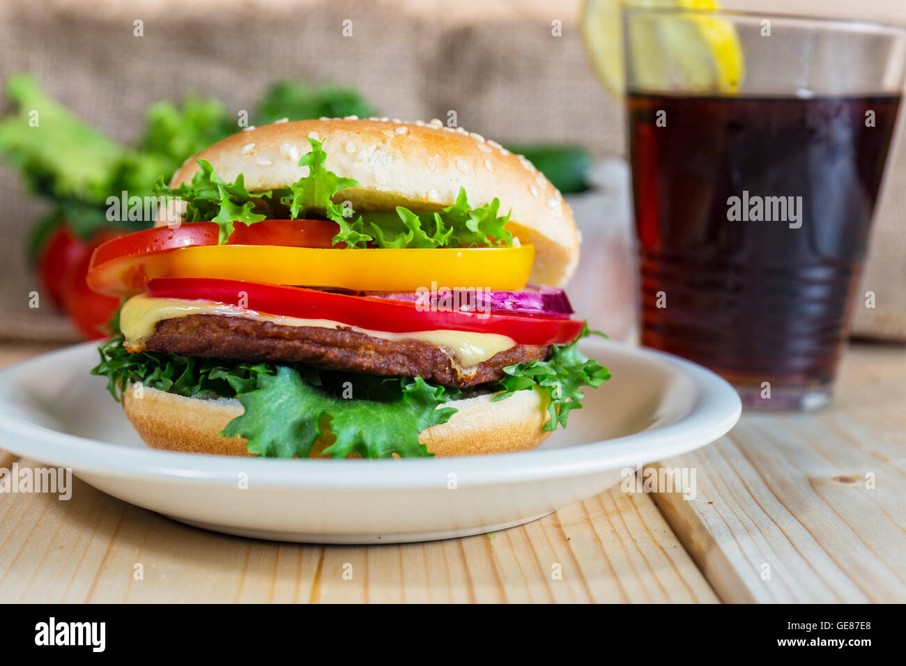hamburger and drink with slice of lemon Stock Photo - Alamy