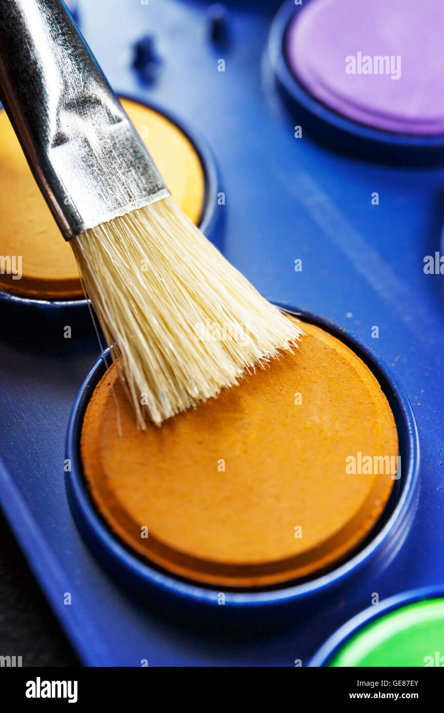 watercolor paints in a box with paintbrush Stock Photo - Alamy