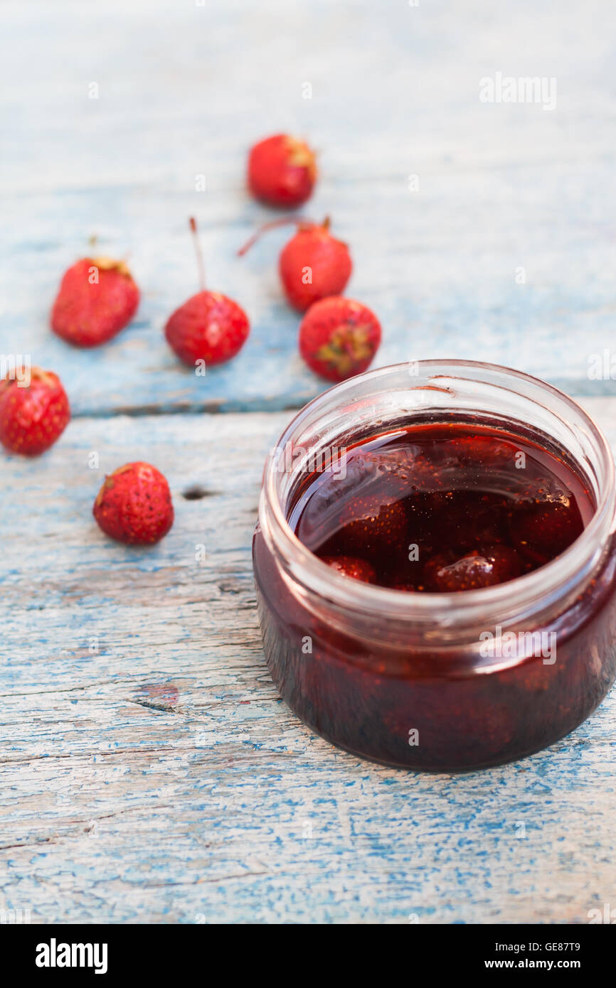liquid strawberry jam in a jar with a spoon Stock Photo - Alamy