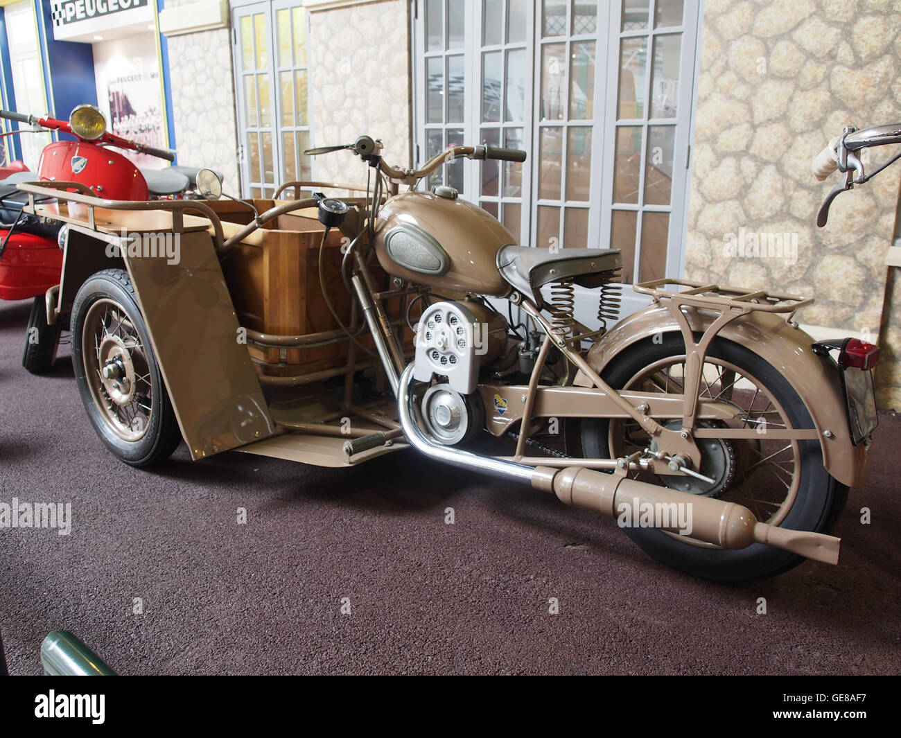 The 1955 Peugeot Triporteur 57 TN, a compact utility three-wheeled ...