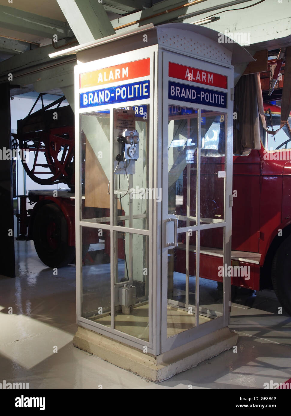 A historical image captures a Dutch telephone booth used by the fire ...