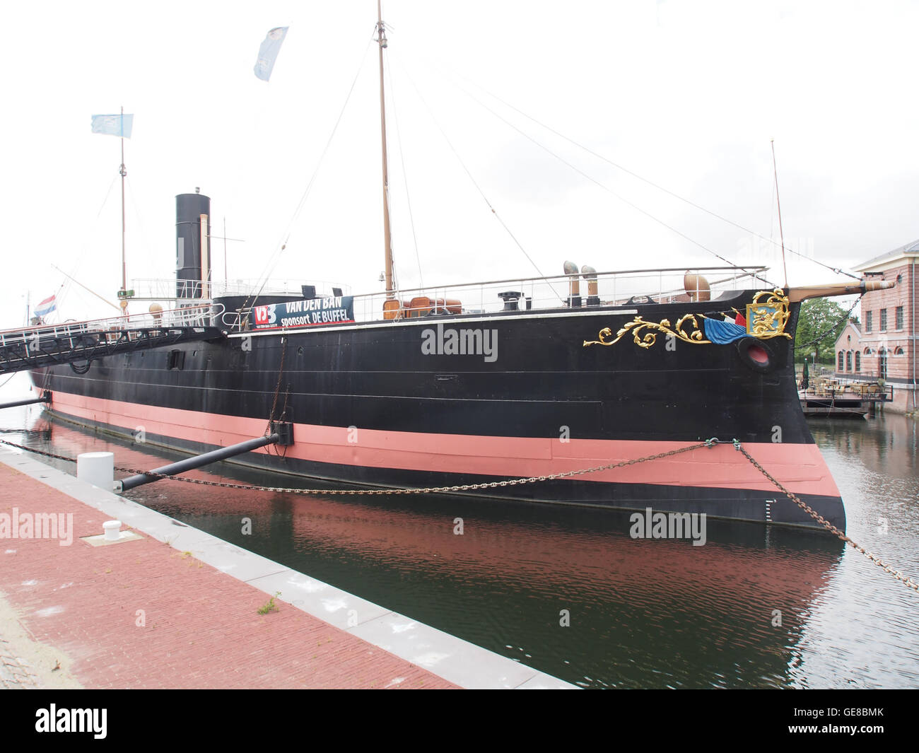 The image titled *De Buffel* captures a moment of a large ship named ...