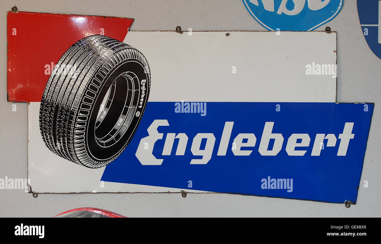 This vintage advertisement for Englebert tires features enamel artwork ...