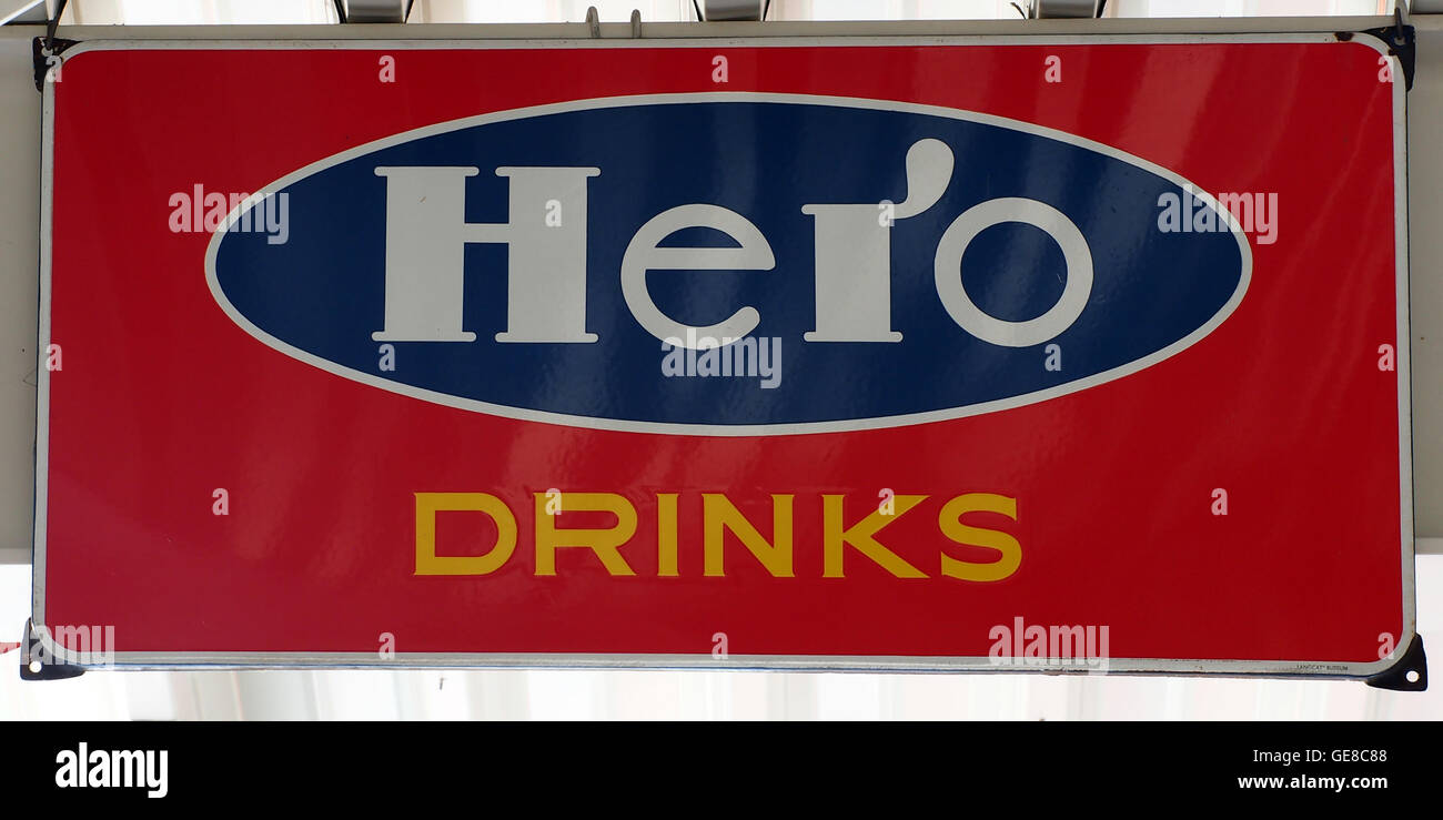 This vintage enamel advertising sign for Hero Drinks reflects mid-20th ...