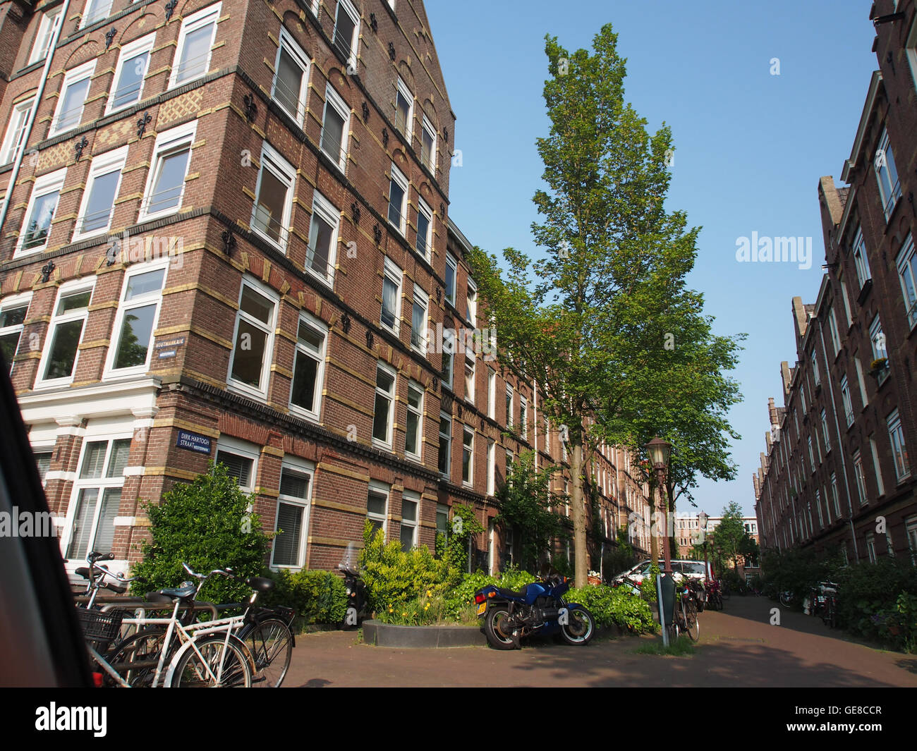 This photograph captures a street scene in Amsterdam, specifically the ...