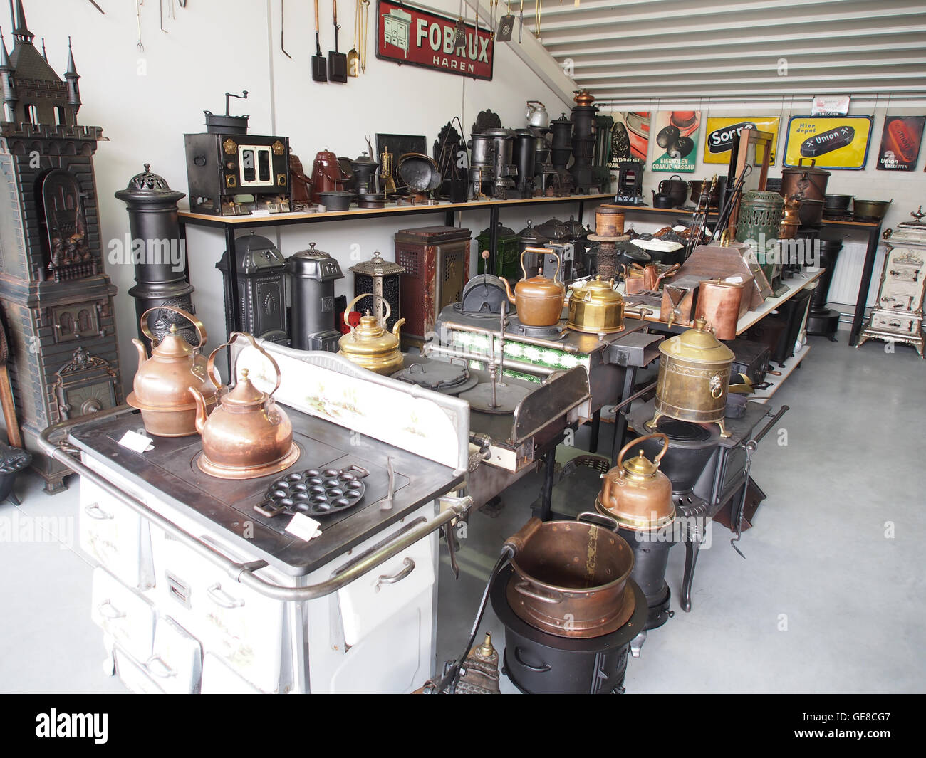 This historical photo shows the 'Kachels en Stoven' section, which ...