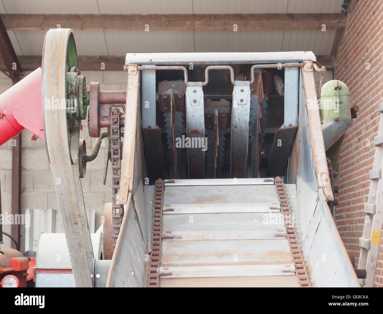 This image depicts a historical farming machine on display at the ...
