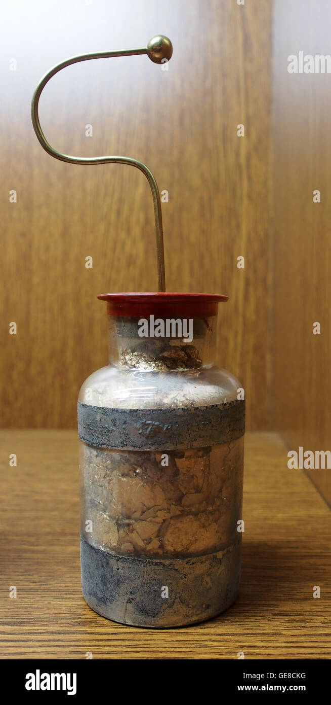 A photograph of a Leyden jar, an early device used to store static ...