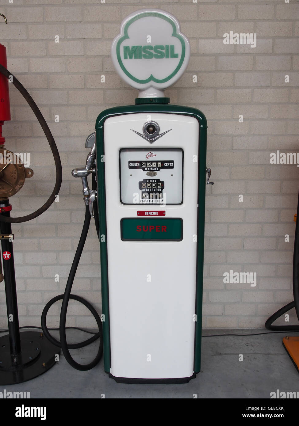 This image features a vintage Gilbarco petrol pump, a key artifact in ...