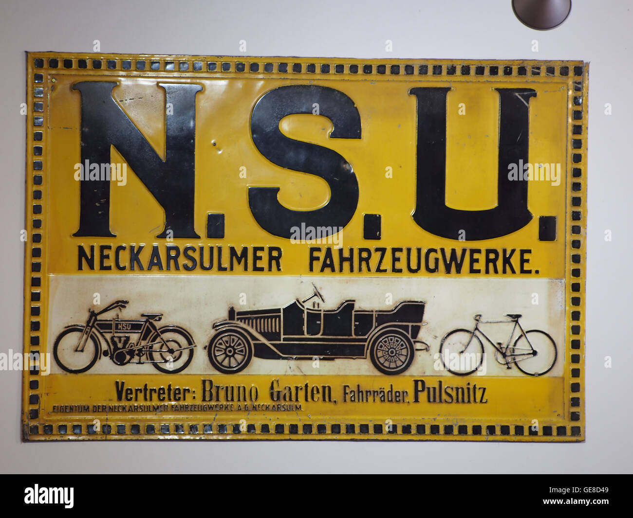 This vintage NSU enamel car advertisement showcases a classic ...