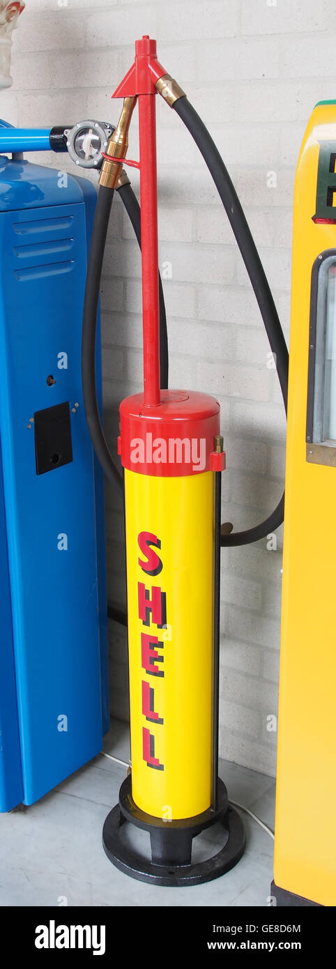 This photograph depicts an old Shell pump, highlighting the classic ...