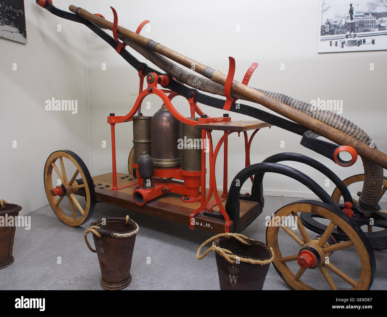 This image features an old fire extinguisher, showcasing vintage ...