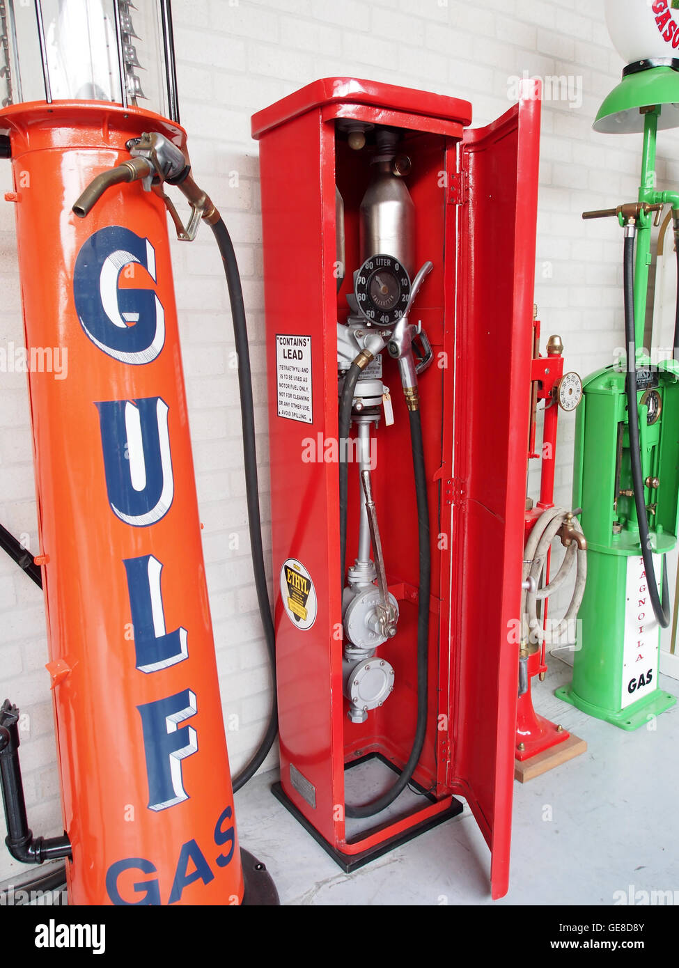 This image depicts an antique ethyl benzine pump, a historical fuel ...
