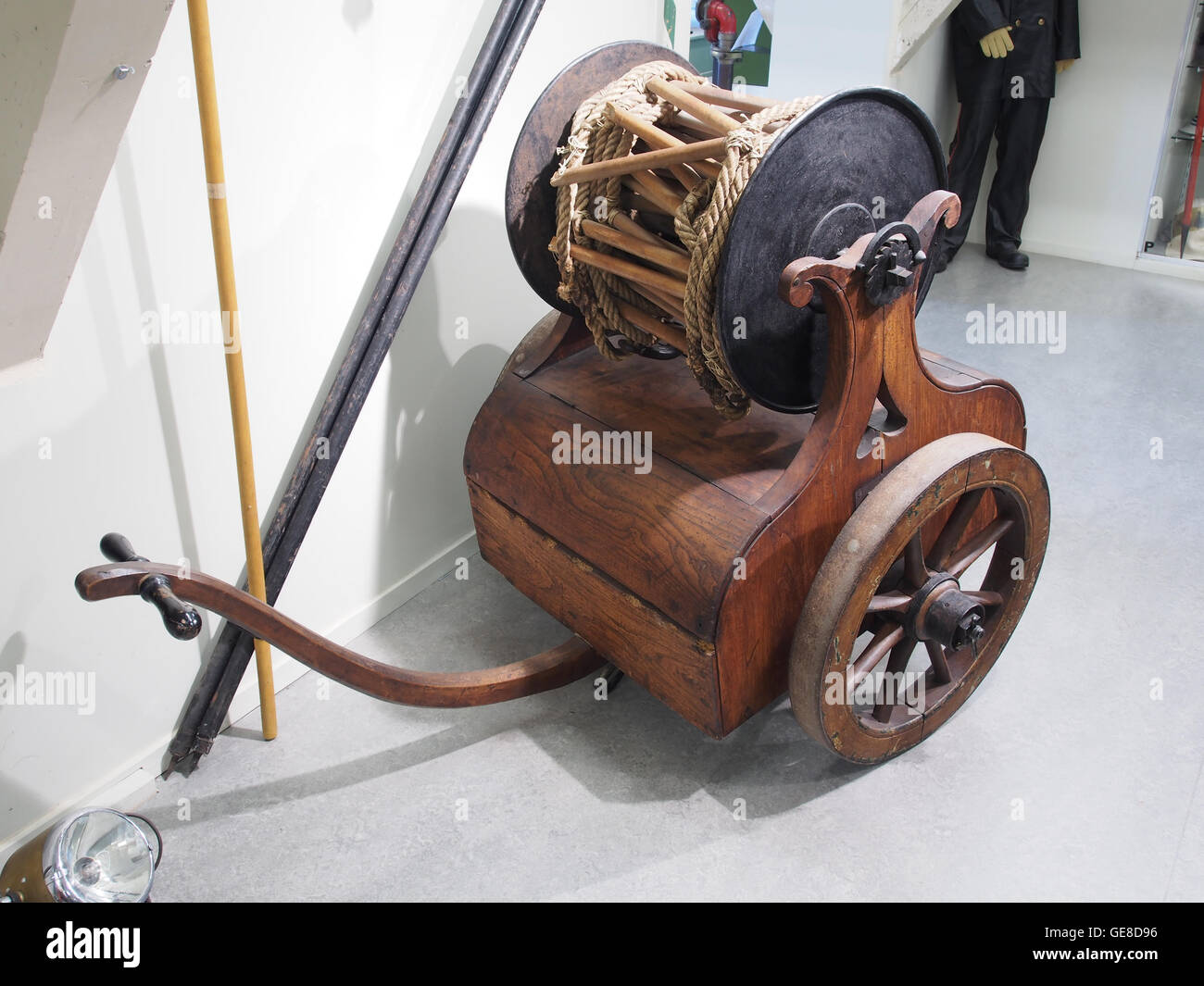 This image shows an old wooden rope ladder cart, an antique vehicle ...