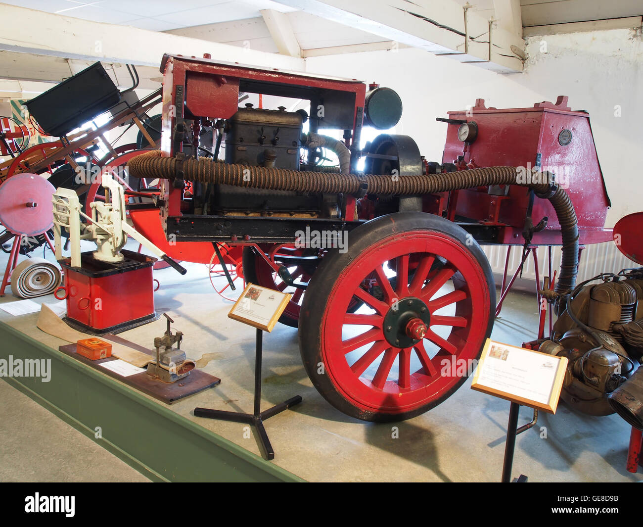 The 'Oude motorbrandspuit' refers to a vintage motorized fire truck, a ...