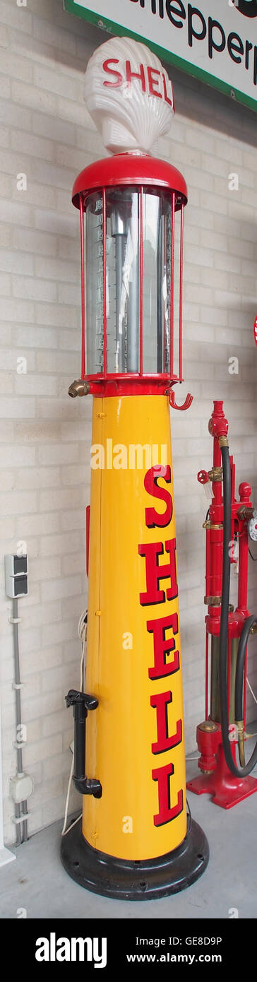This vintage photograph shows an 'Oude Shell' gasoline pump, a piece of ...