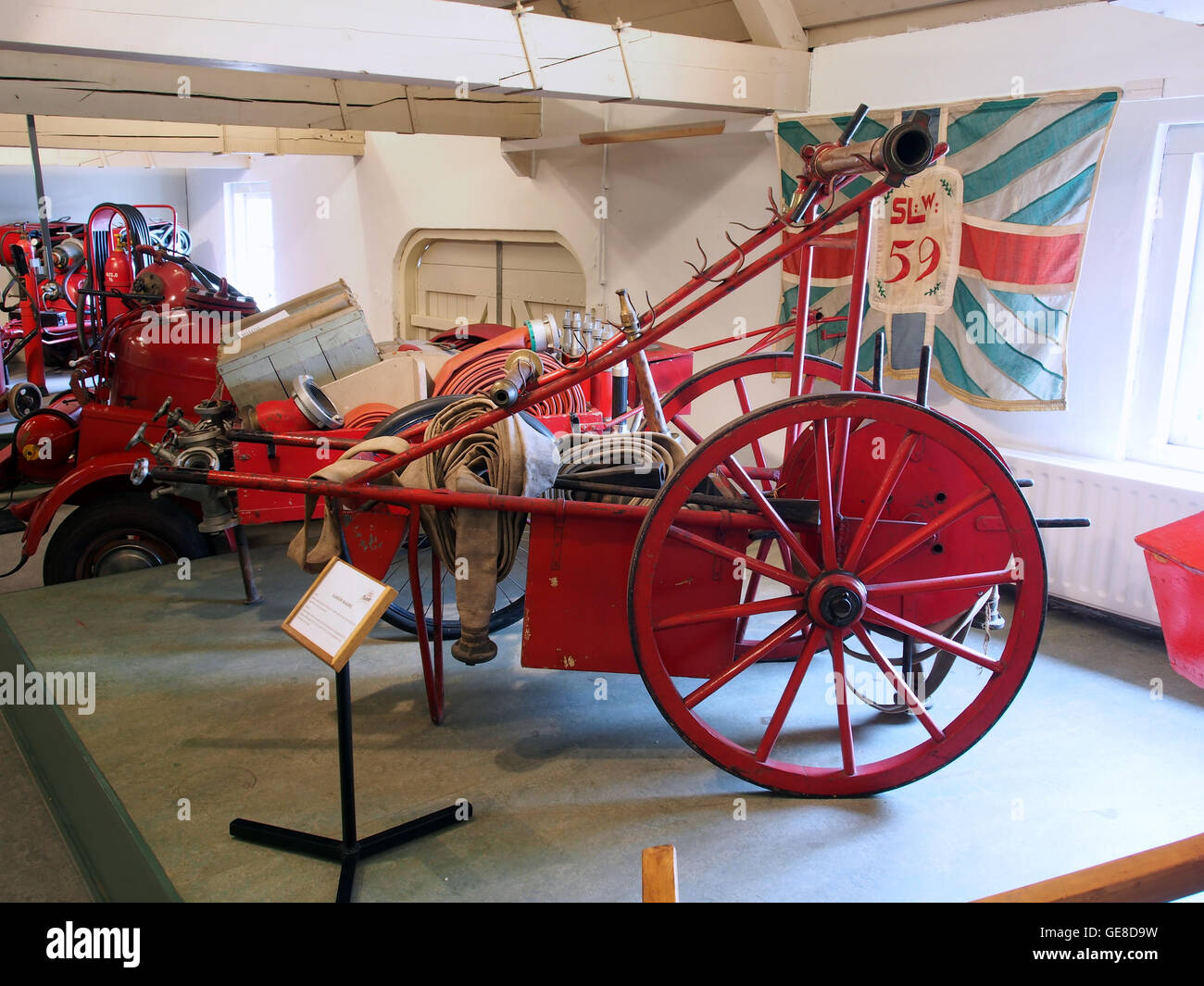 This image features an antique snake cart, a historical vehicle used ...