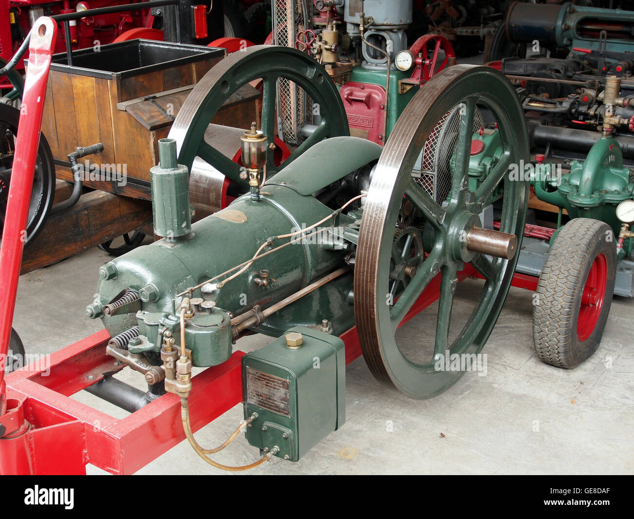 The image shows an antique stationary engine displayed at the Museum ...