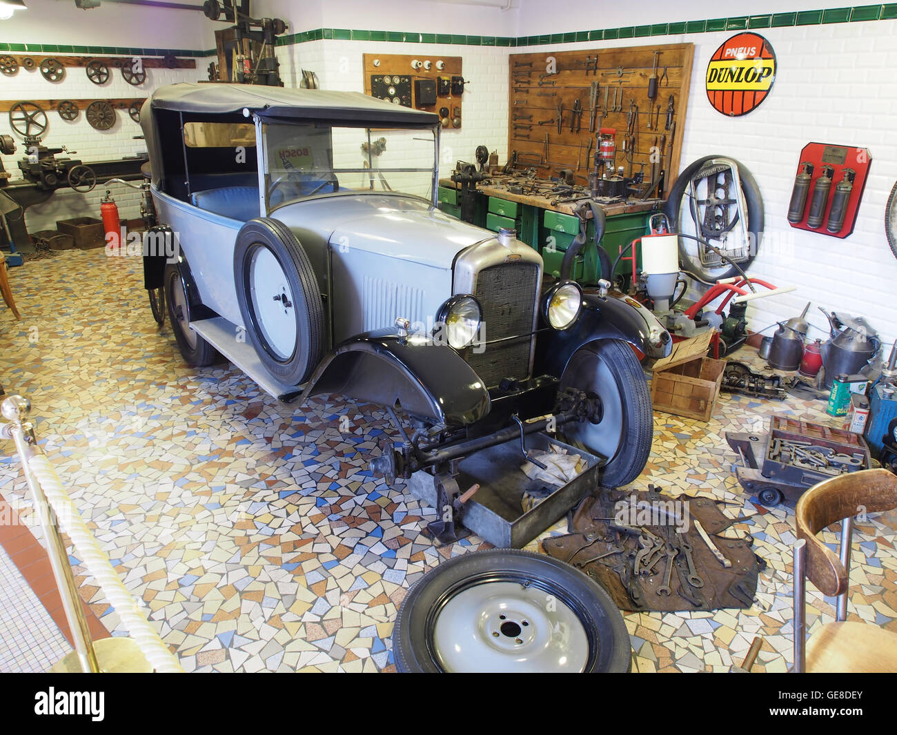 This photograph shows a Peugeot vehicle in a workshop, highlighting the ...