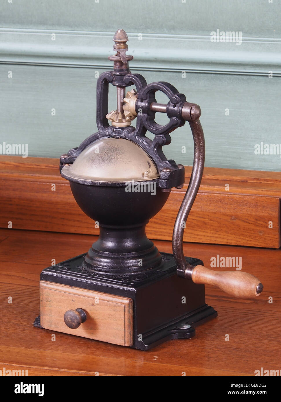 The image showcases a vintage Peugeot Moulin café grinder, reflecting ...