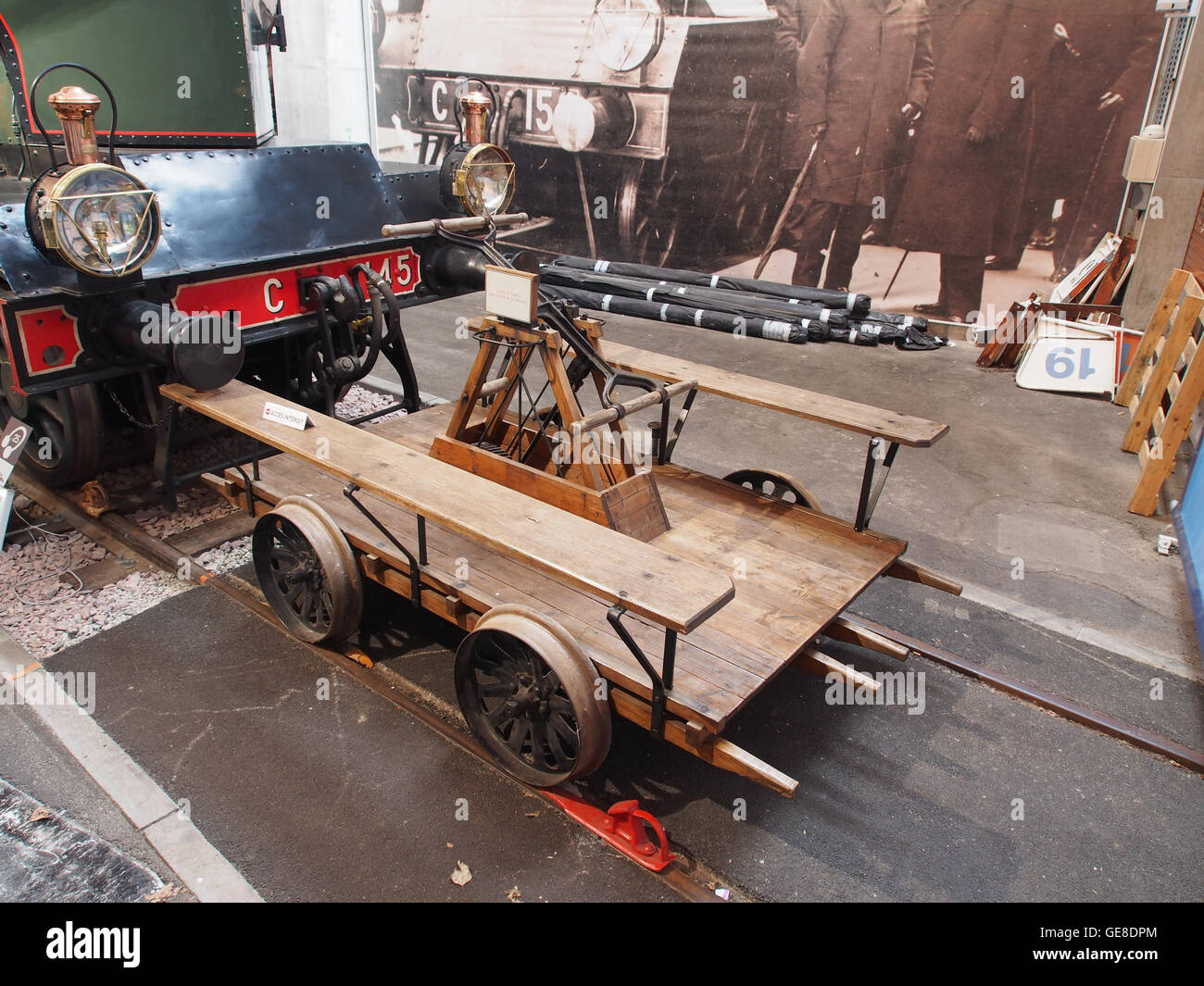 This image depicts a historical railway inspection cart, an essential ...