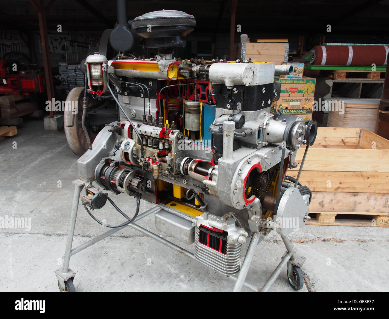 This image displays an open-sectioned Saurer Suisse engine at the ...