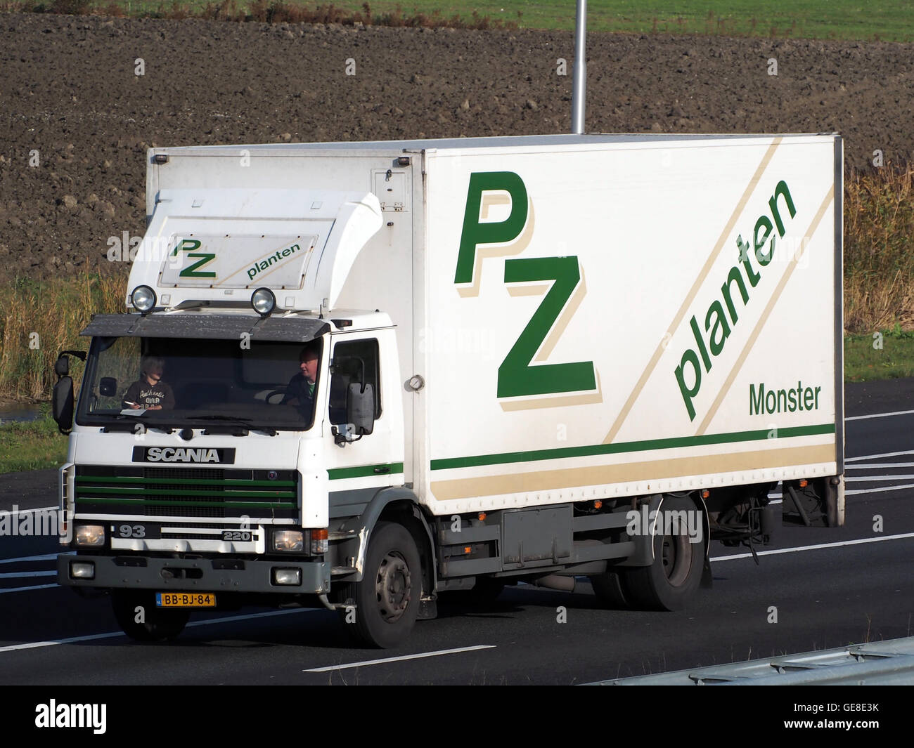 The Scania 220, a truck model, is depicted alongside the PZ planten ...