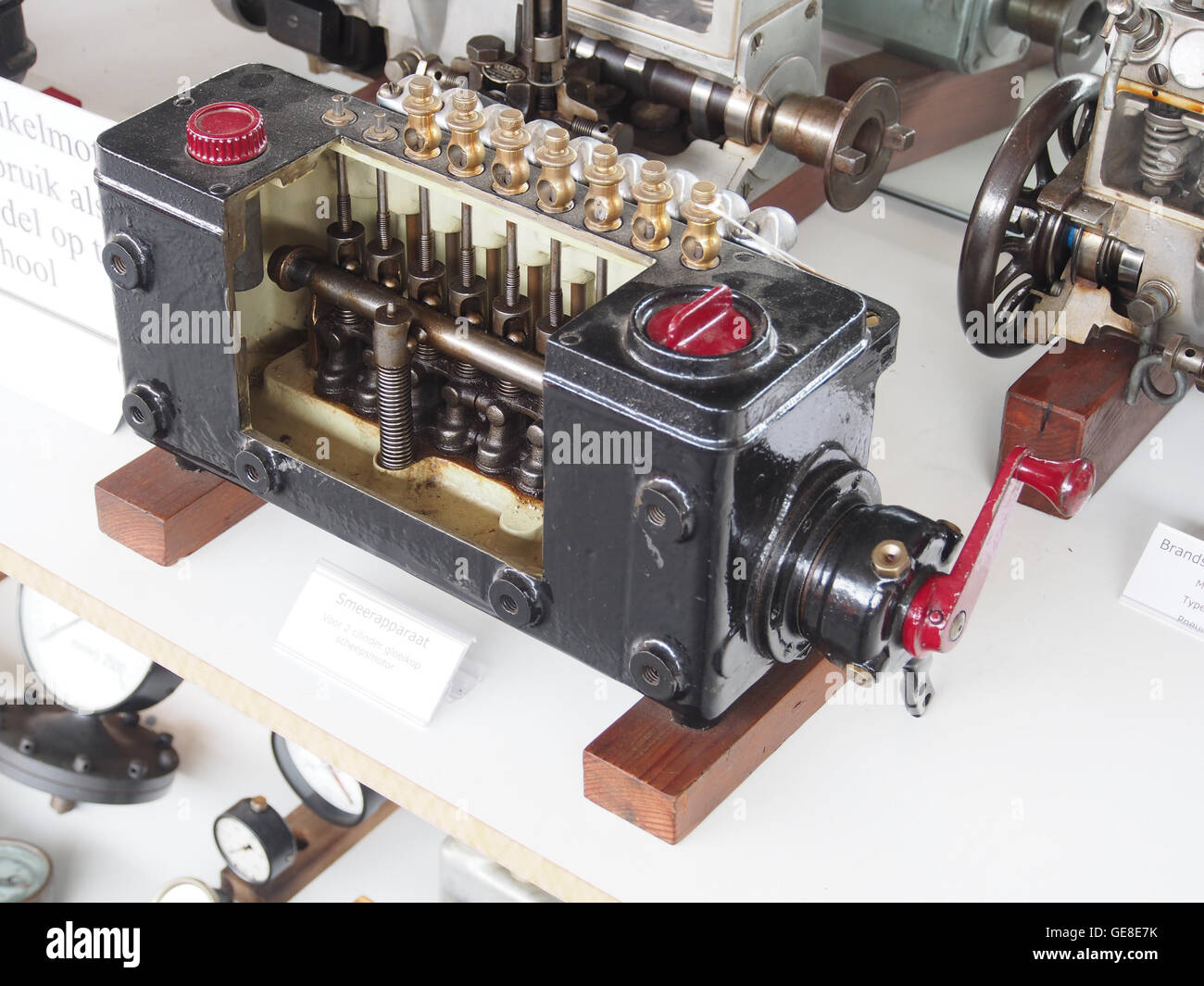 This image shows a lubrication device for a two-cylinder glow plug ...