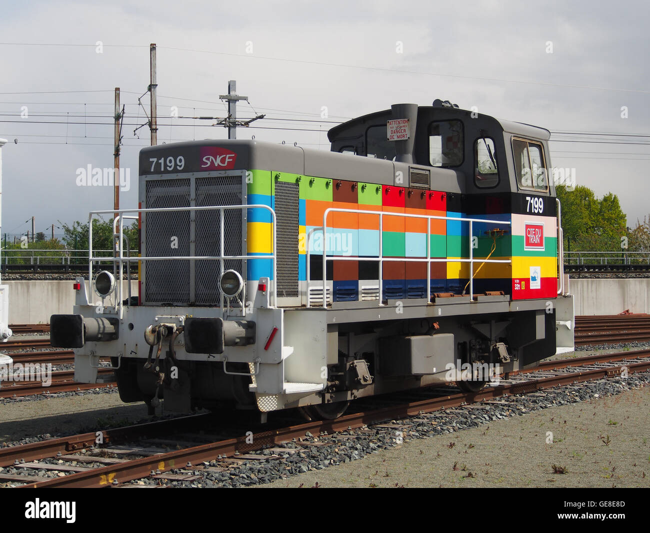 This photograph captures the SNCF 7199, a notable French steam ...