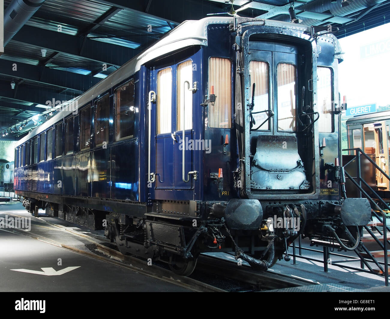 This image features a historic train wagon, likely from the late 19th ...